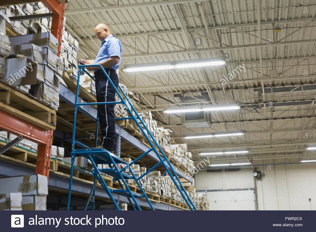 Worker on ladder hi-res stock photography and images - Alamy