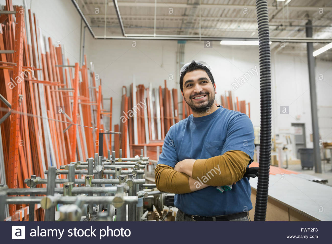 Worker smiling factory hi-res stock photography and images - Alamy
