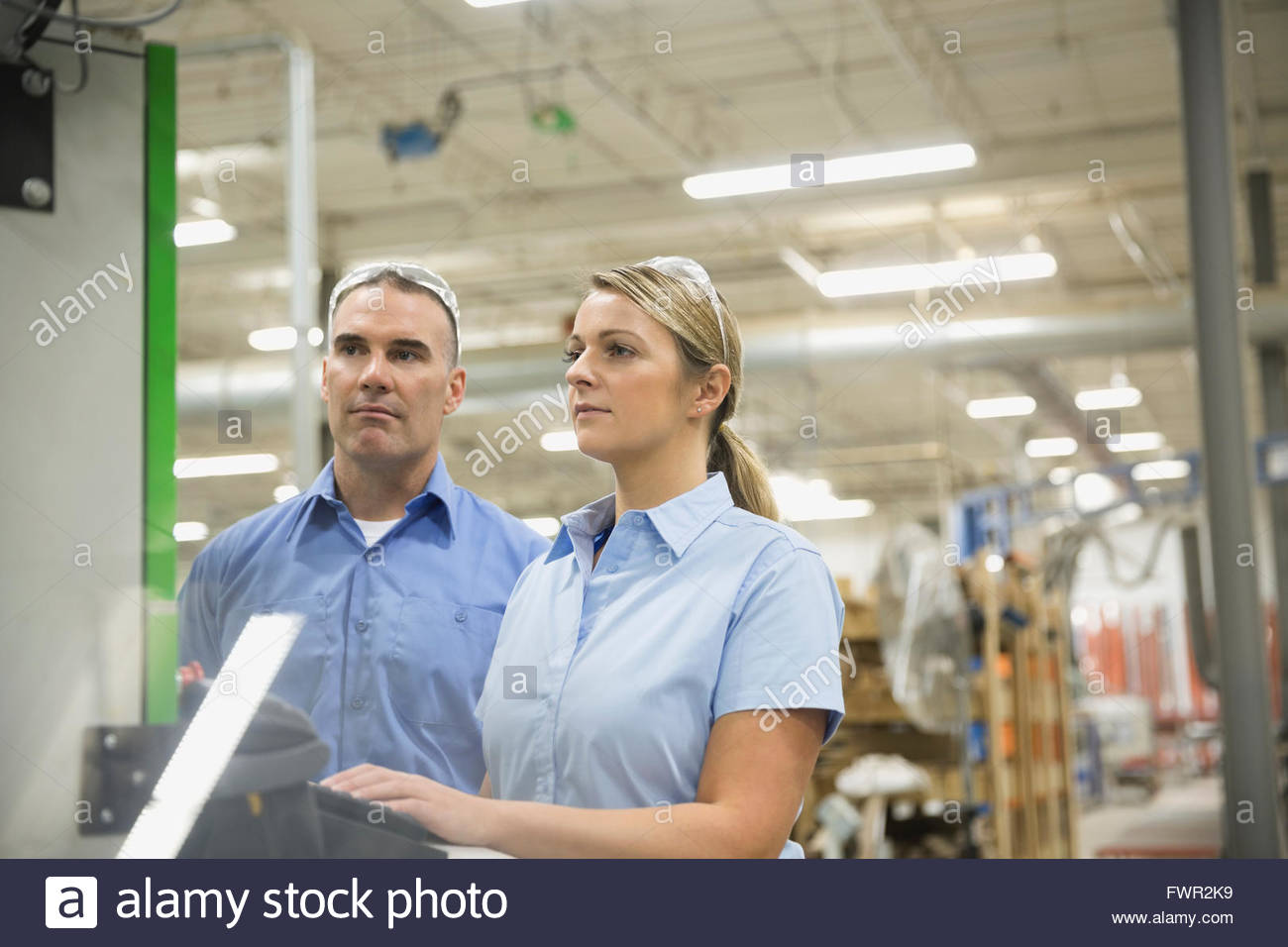 Manufacturing technology workers hi-res stock photography and images ...