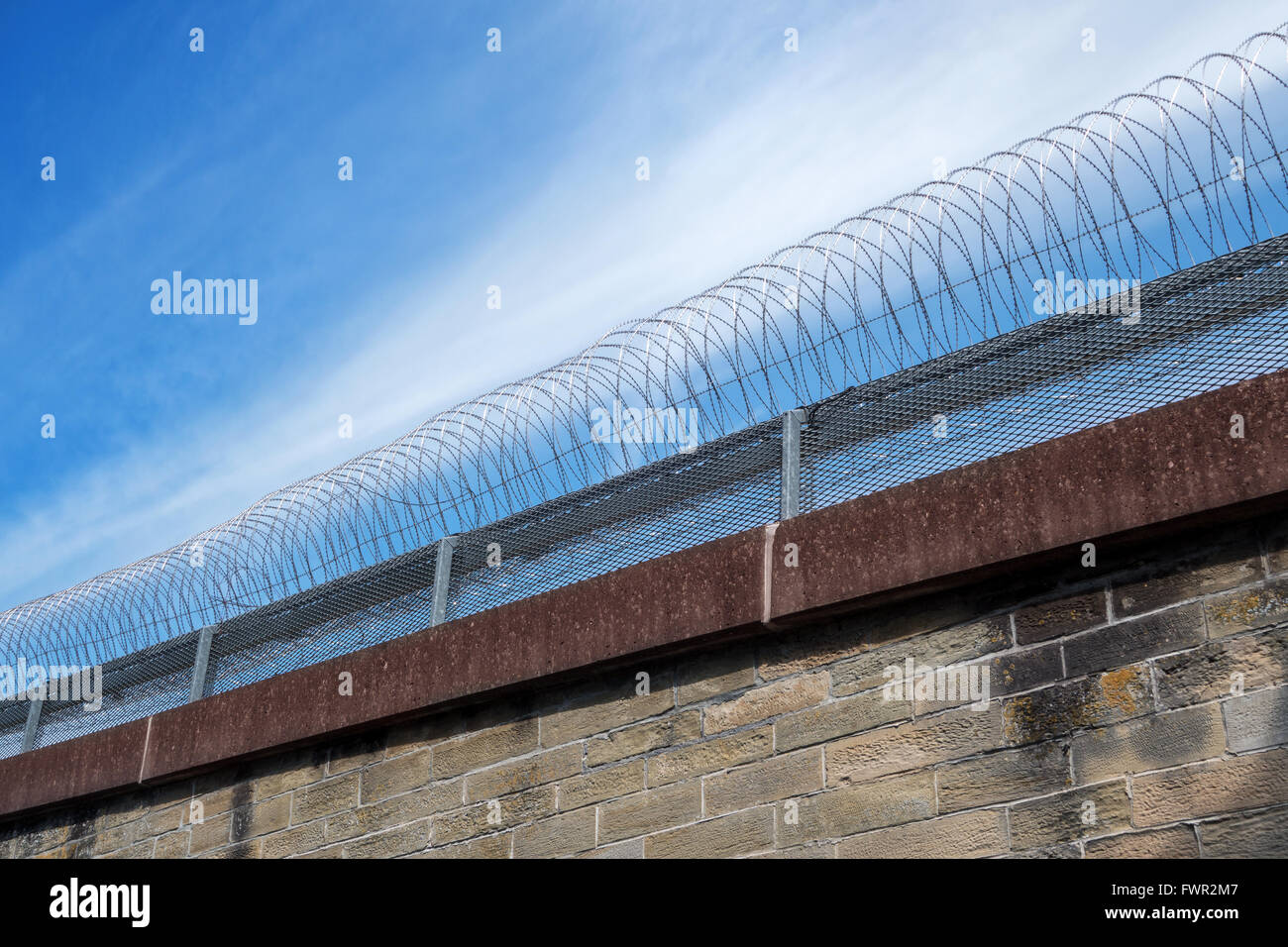 Wall with barb wire hi-res stock photography and images - Alamy