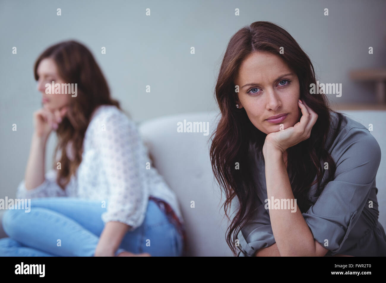 Woman ignoring her friend after an argument Stock Photo - Alamy