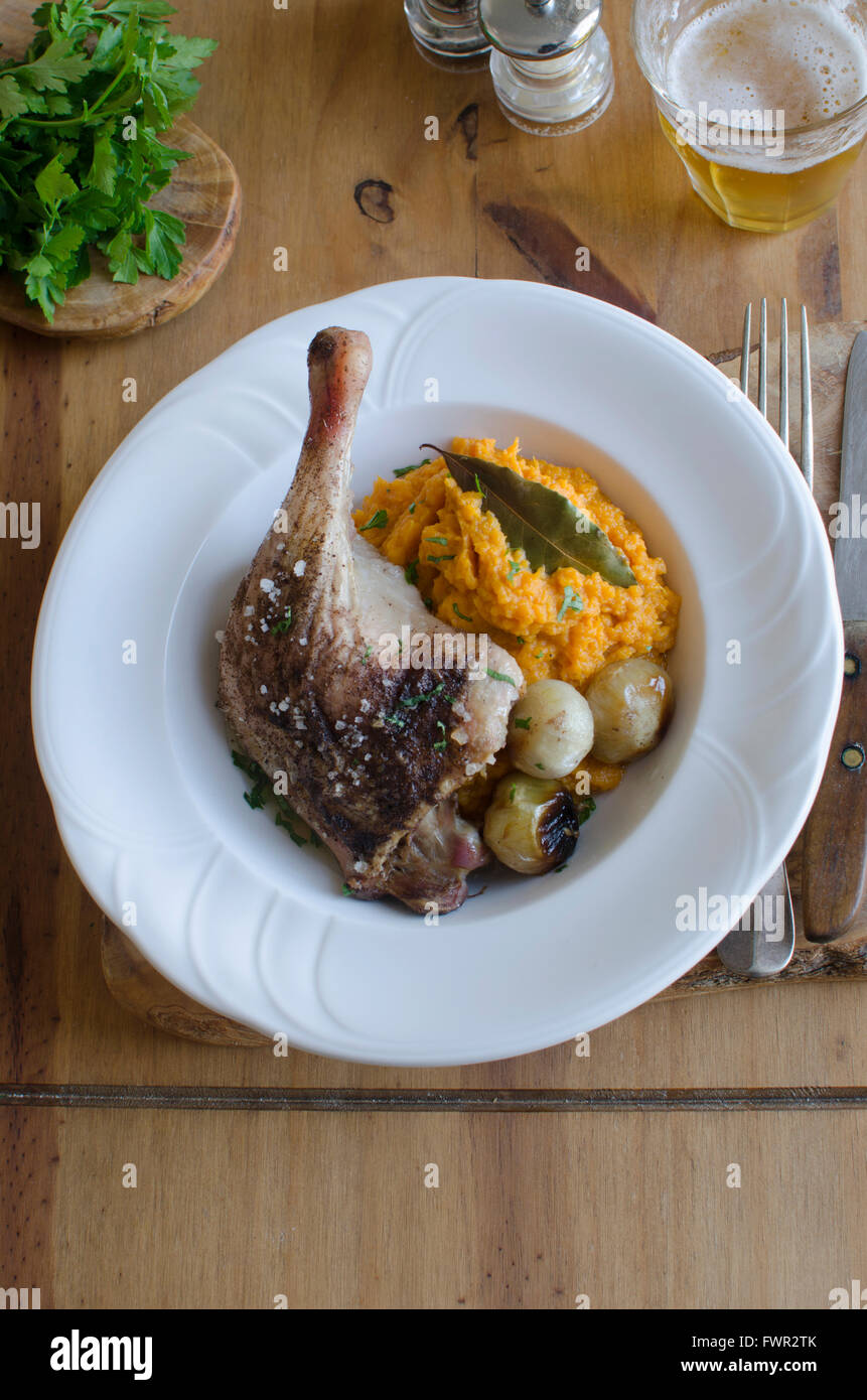 Roast duck leg with sweet potato mash Stock Photo - Alamy