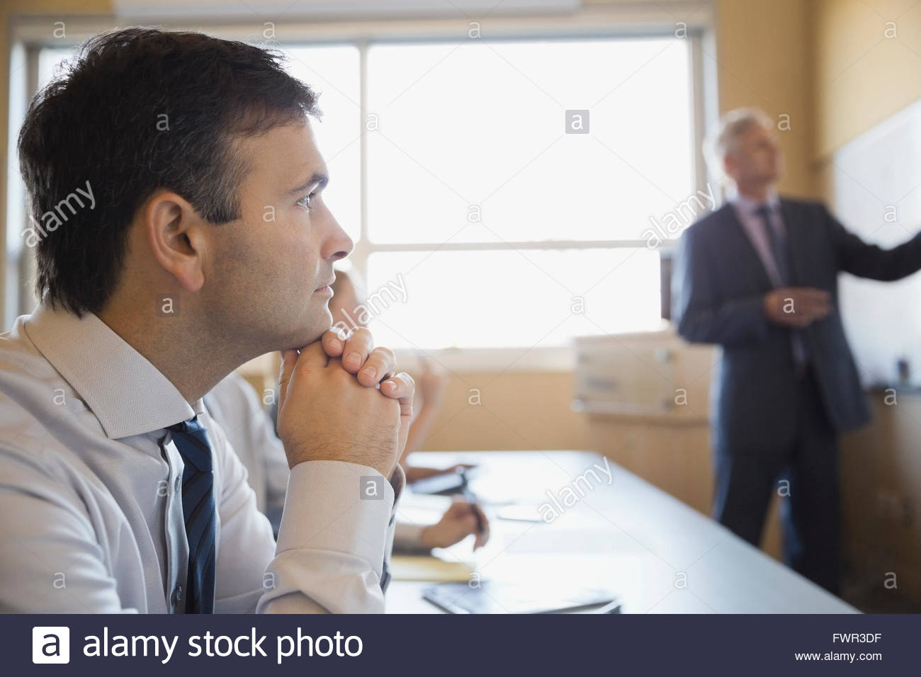 Attentive businessman in training class Stock Photo - Alamy