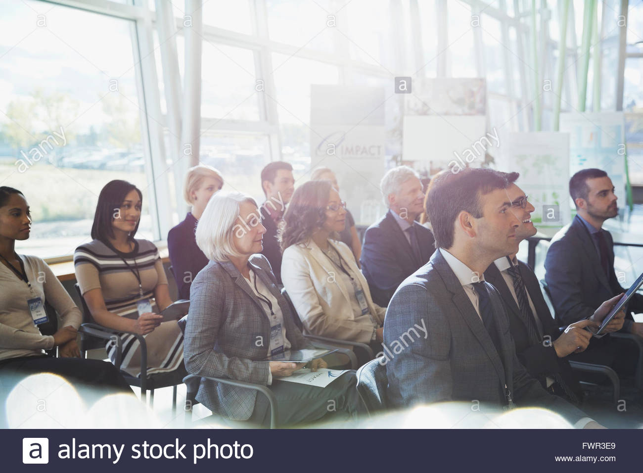 Group of business people attending conference Stock Photo - Alamy