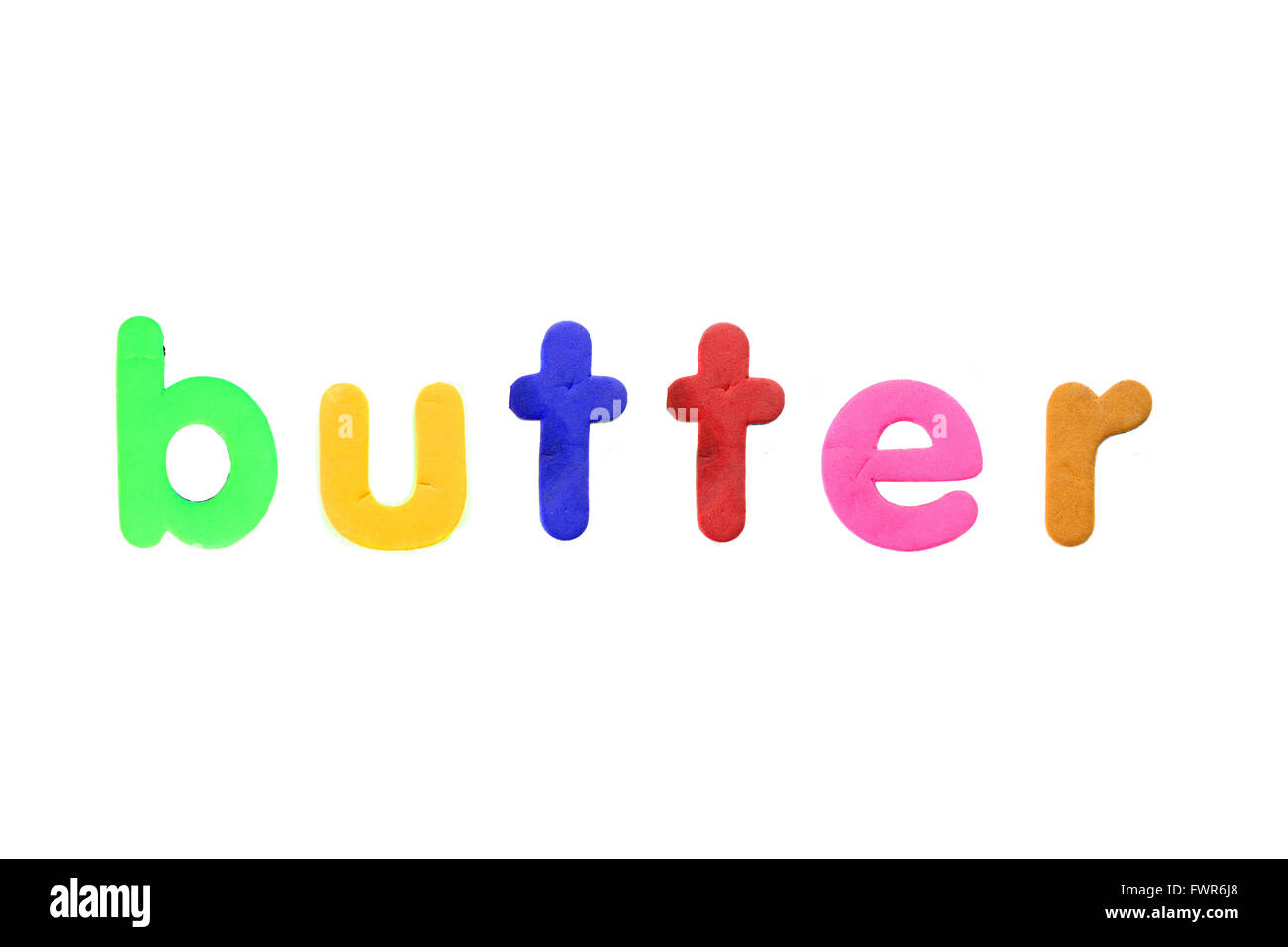 The word butter created from alphabetic fridge magnets against a white ...