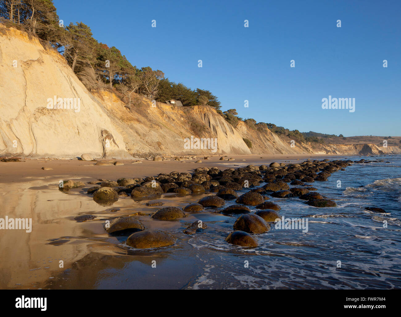 Round stones at Bowling Beach, coast, pacific ocean, Anchor Bay ...