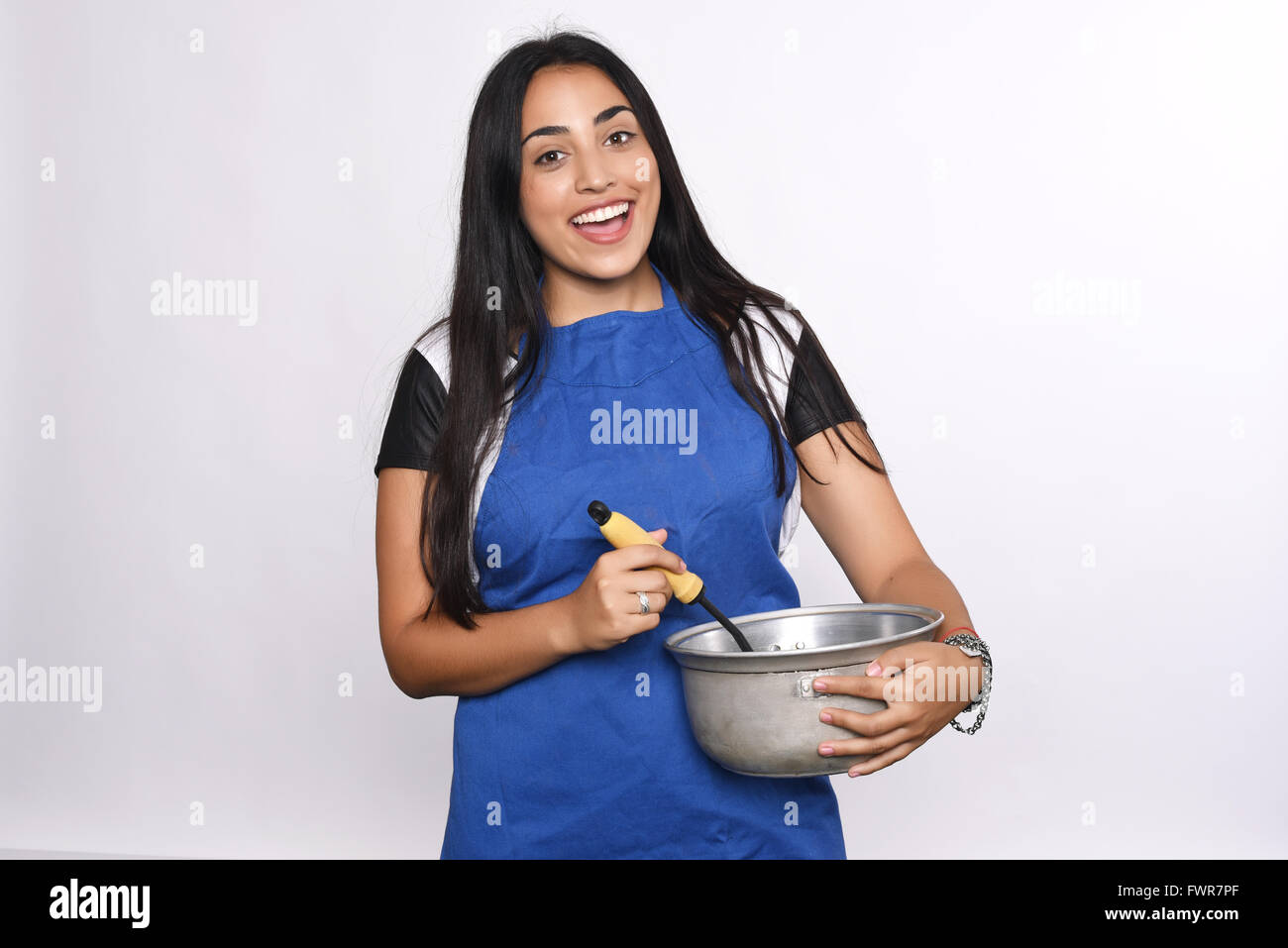 Young beautiful woman cooking. Isolated white background Stock Photo ...