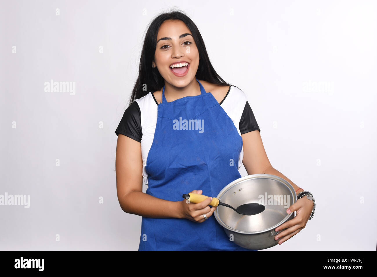 Young beautiful woman cooking. Isolated white background Stock Photo ...