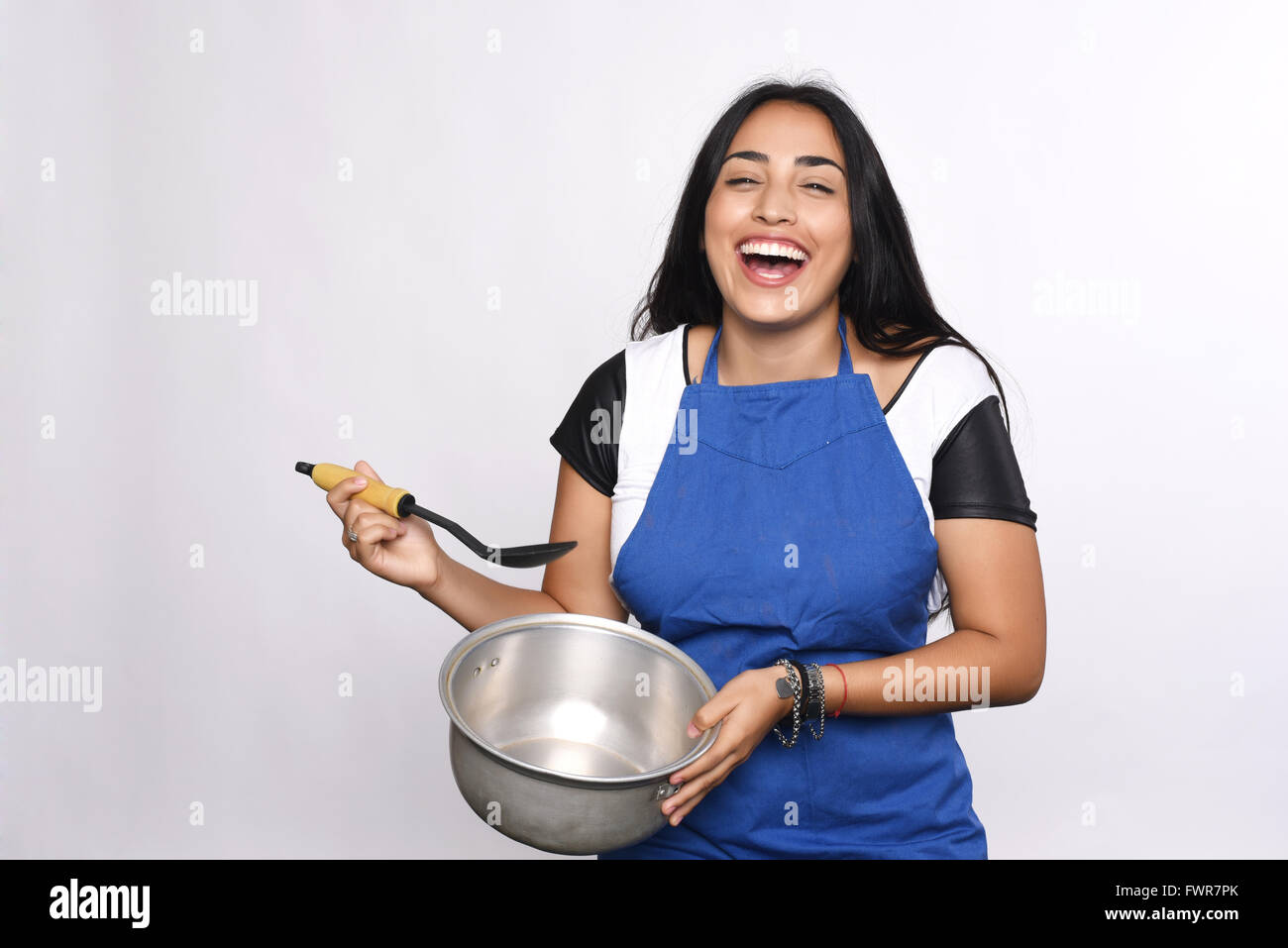 Young beautiful woman cooking. Isolated white background Stock Photo ...