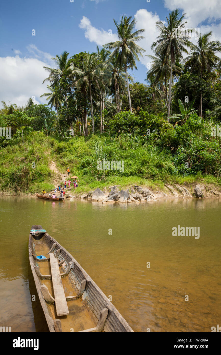 Traditional carved wood or timber boats on a river, northern Sabah ...