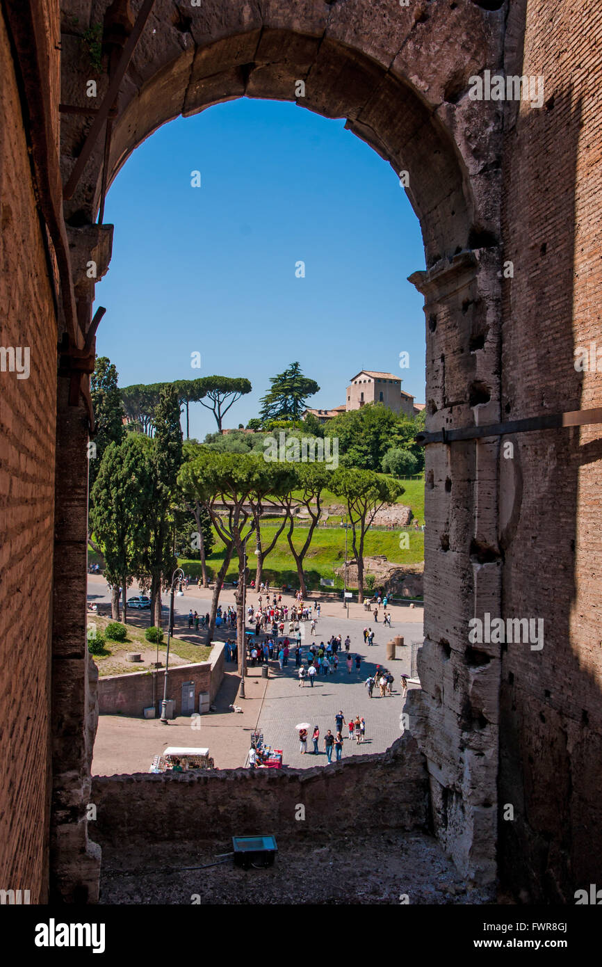 View through an arch of the Colosseum on the square Colosseum Stock ...