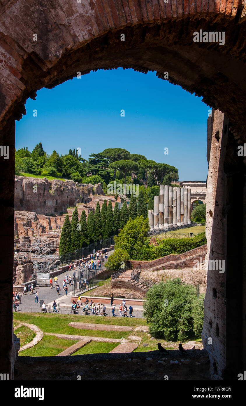 View through an arch of the Colosseum on the Sacred road Stock Photo ...