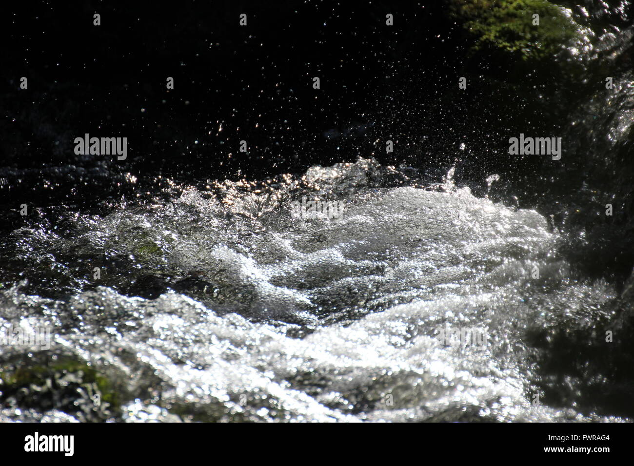 Spraying water in a stream Stock Photo - Alamy