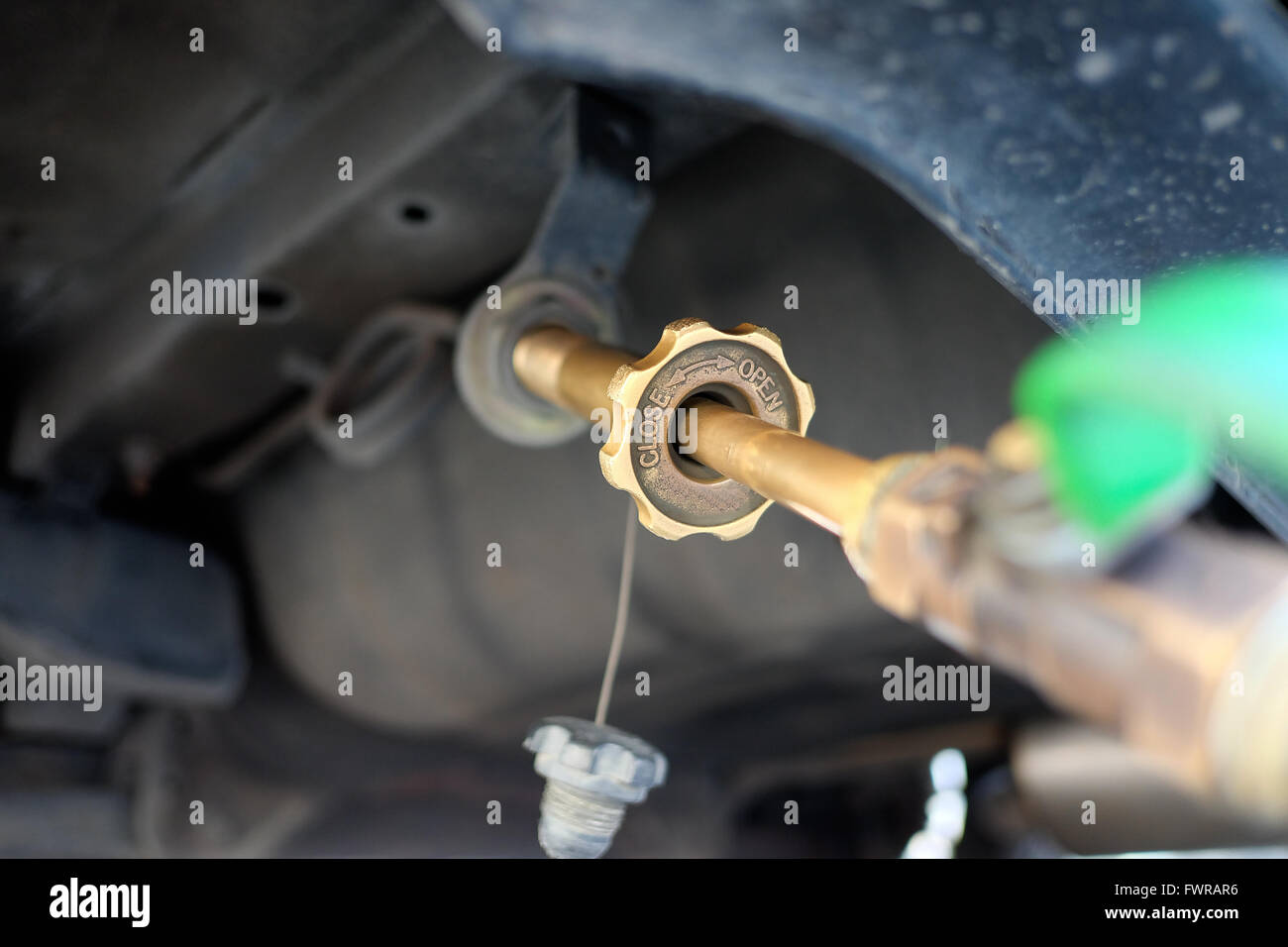 Refuel car at gas station filled with fuel LPG gas in Thailand ...