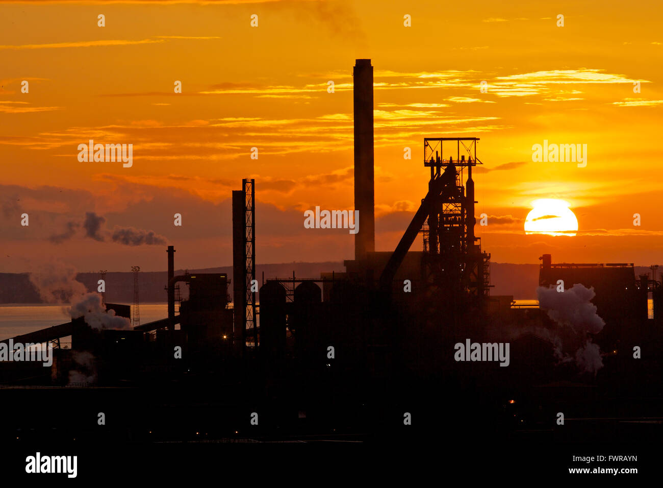 Tata Steel works, Port Talbot, South Wales, UK. Sun setts over Tata ...
