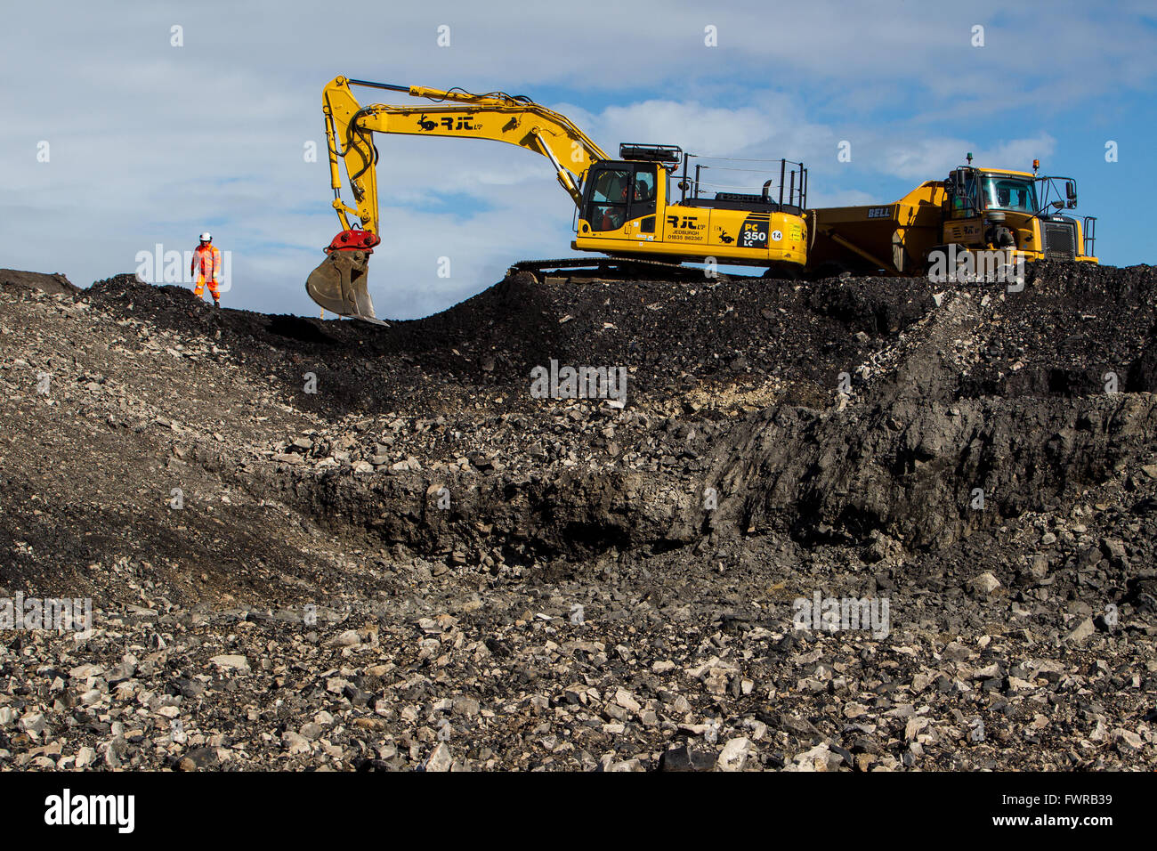 Diggers working during construction of Borders Railway, clearing rocks ...