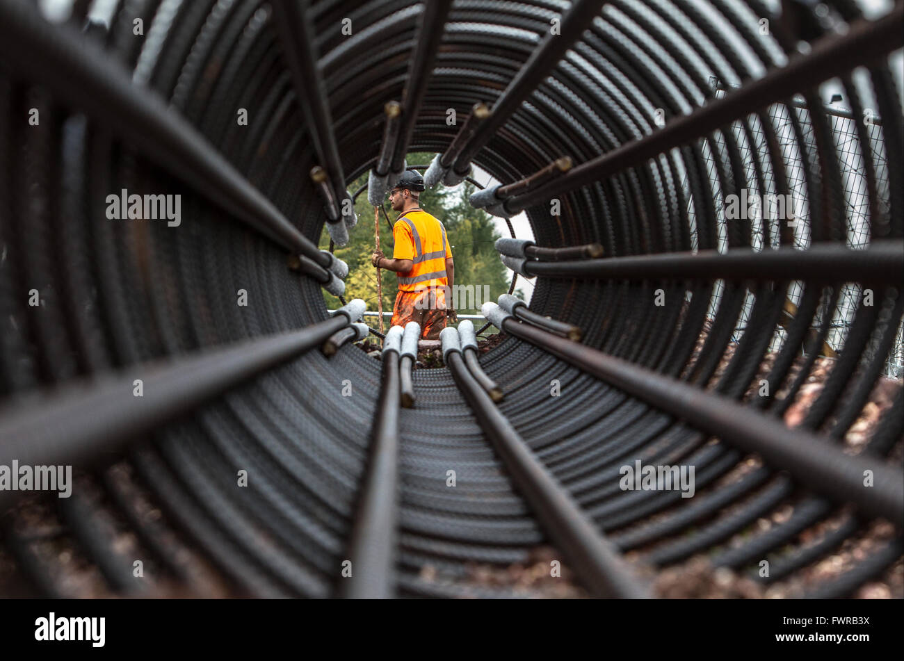 Construction worker framed in pipework during Borders Railway ...