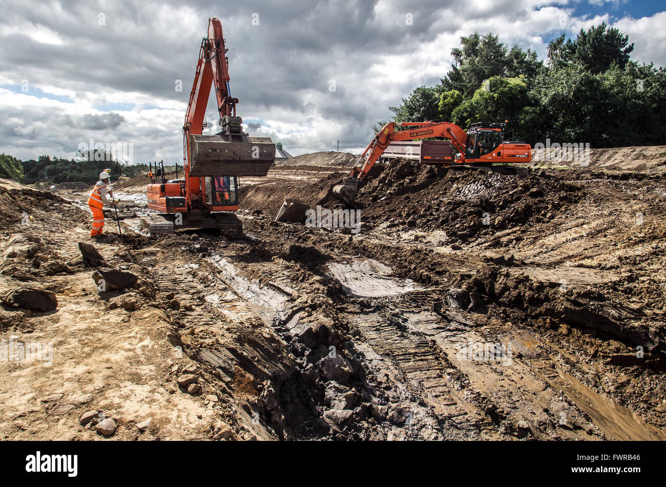 Digger working in quarry during construction of Borders Railway Stock ...
