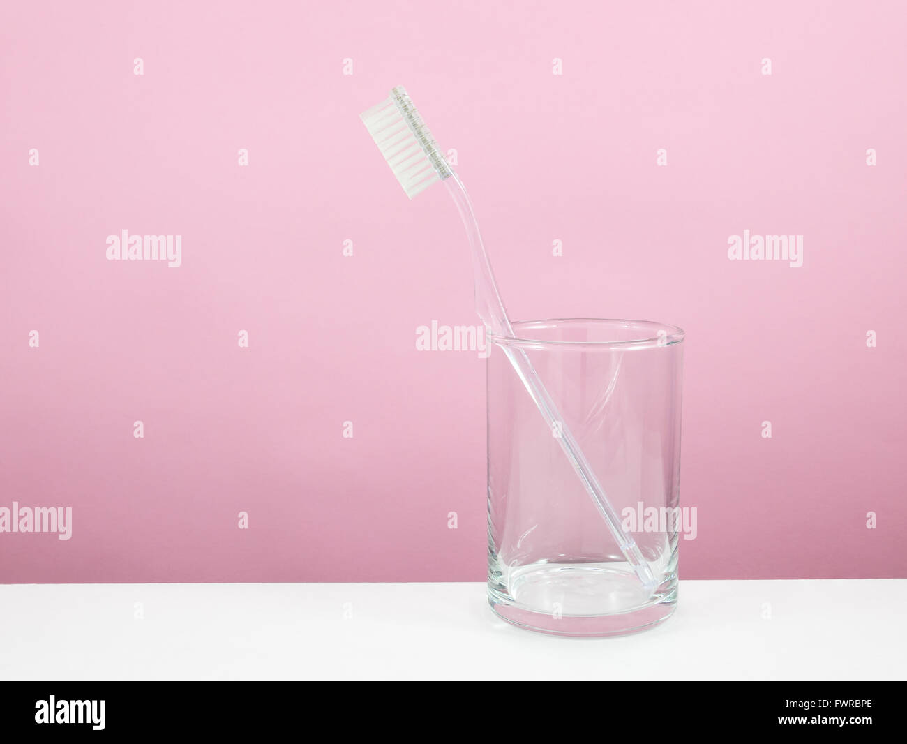 The clear toothbrush with small glass for brushing the teeth Stock ...