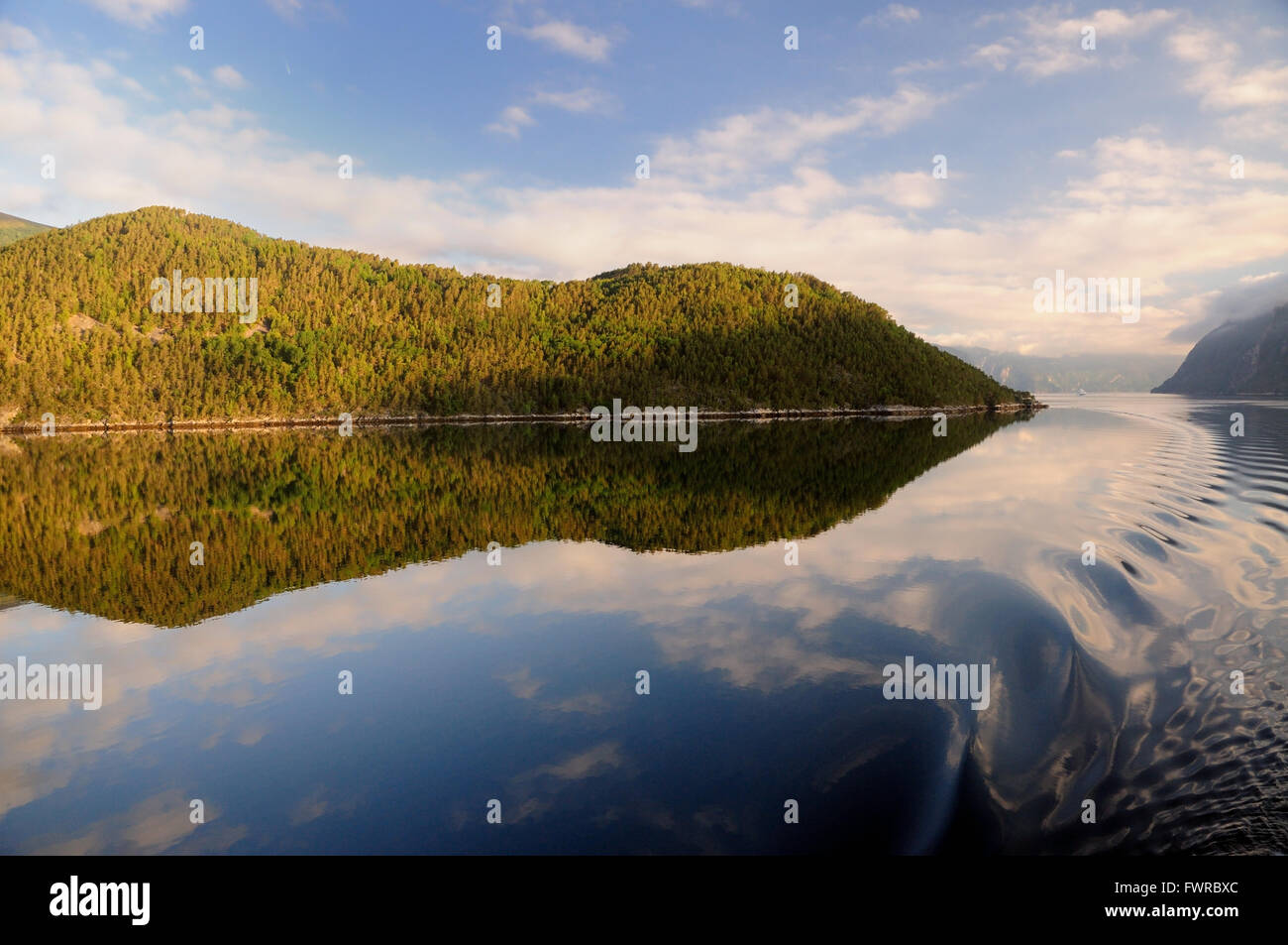 Early morning reflections in a Norwegian fjord on midsummers day Stock ...