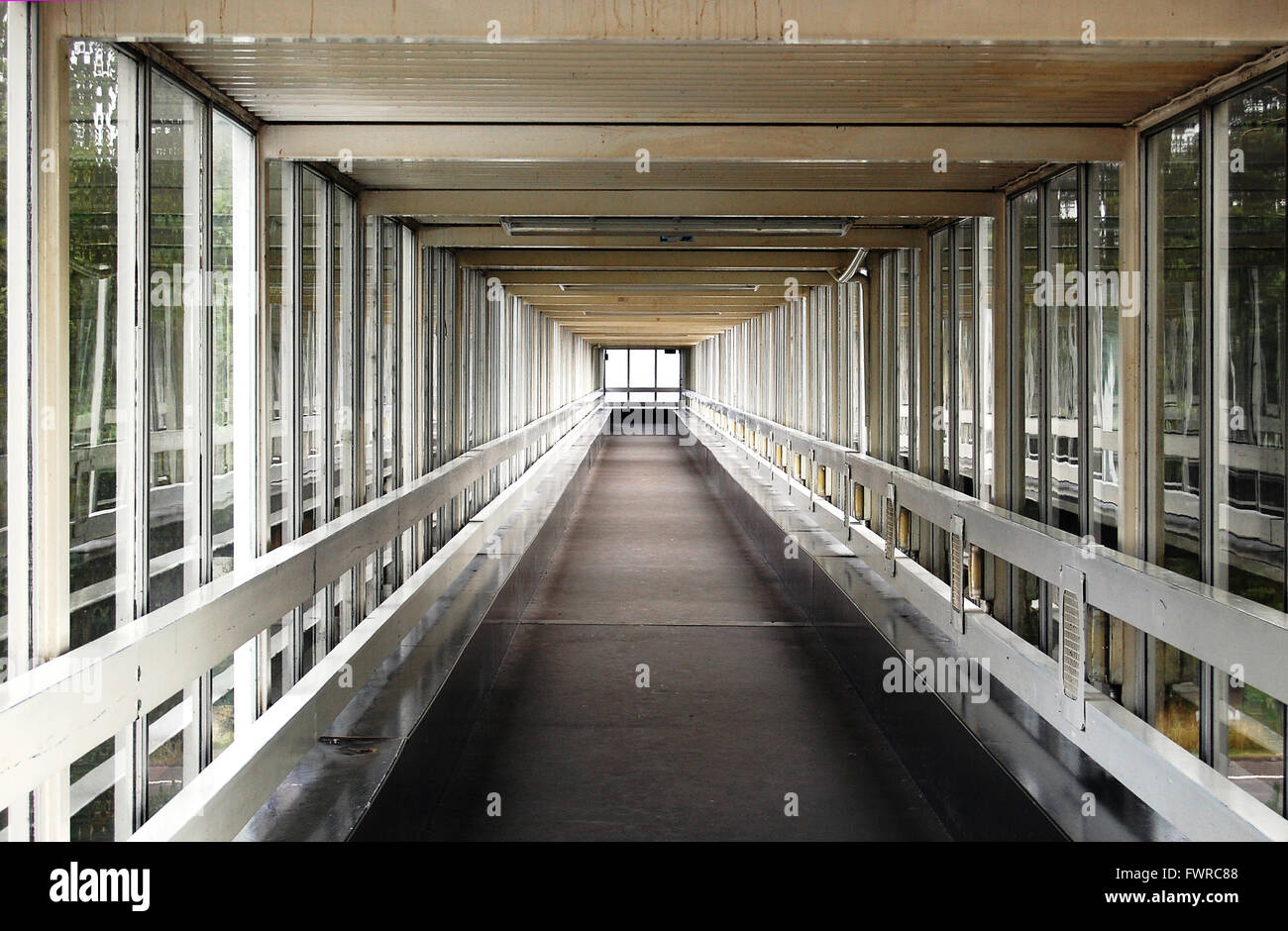 Walkway over motorway at service station Stock Photo - Alamy