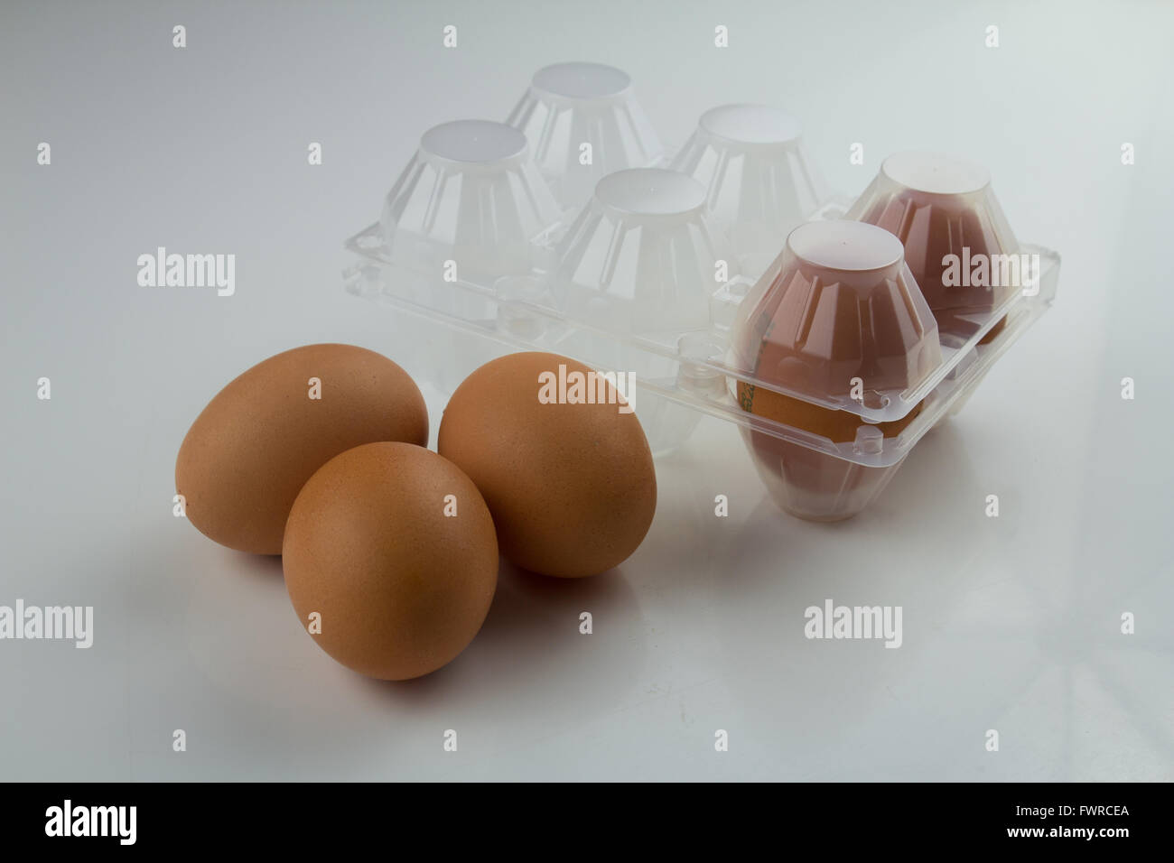 Eggs and transparent eggshell isolated on white background Stock Photo ...