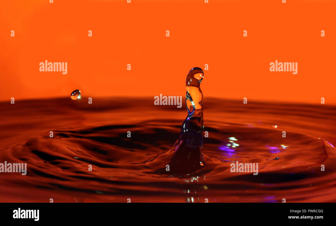 Water drops creating a ripple Stock Photo - Alamy