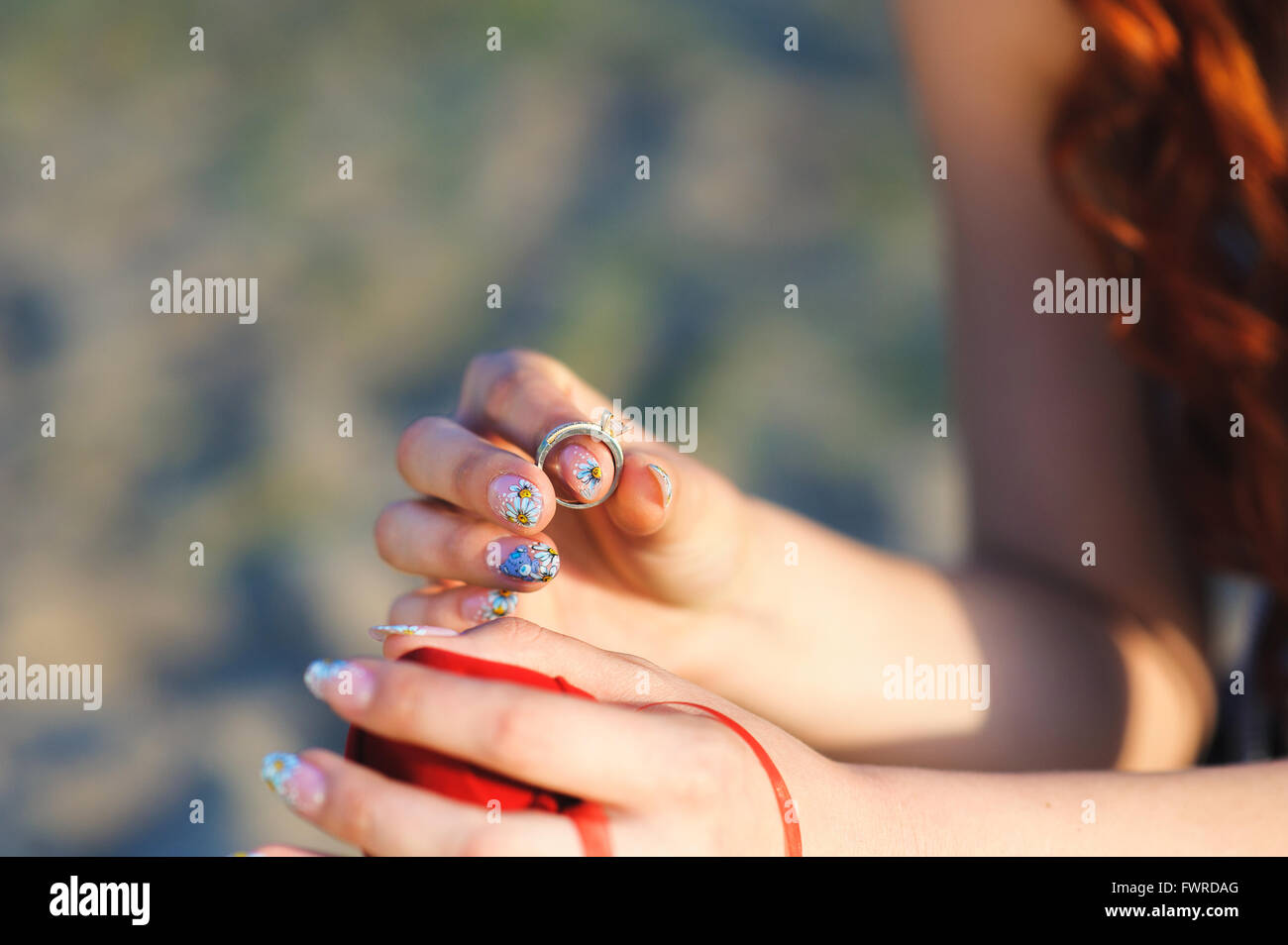 Put ring on hand Stock Photo - Alamy
