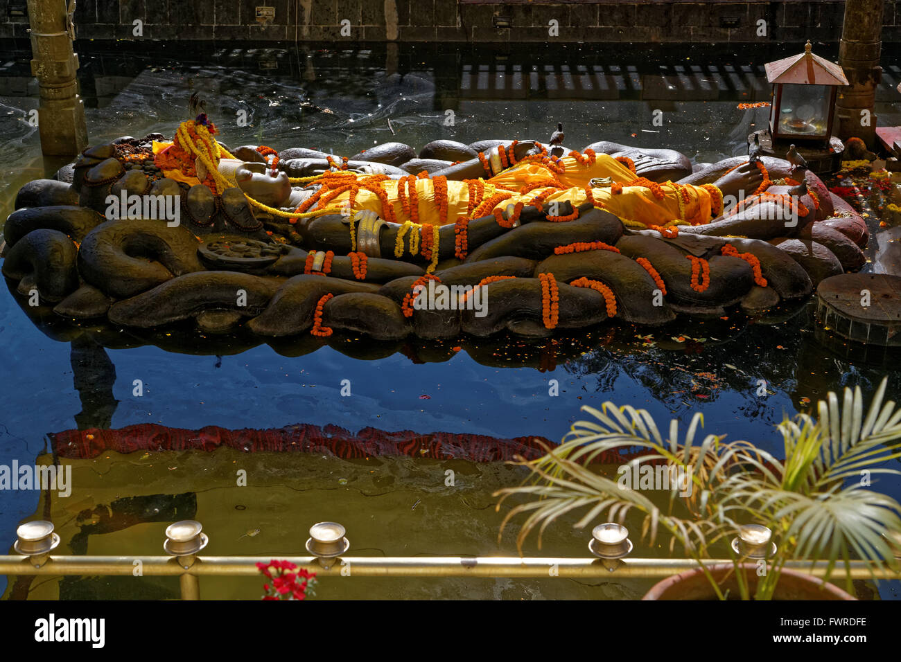 Vishnu Narayana rests asleep on the serpent with multiple convolutions ...