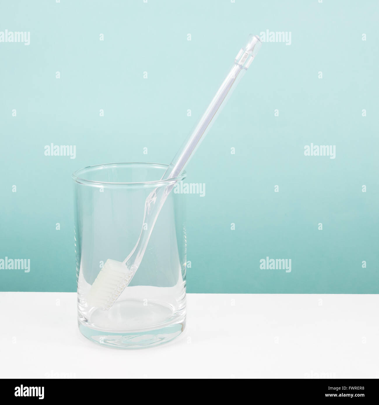 The clear toothbrush with small glass for brushing the teeth Stock ...
