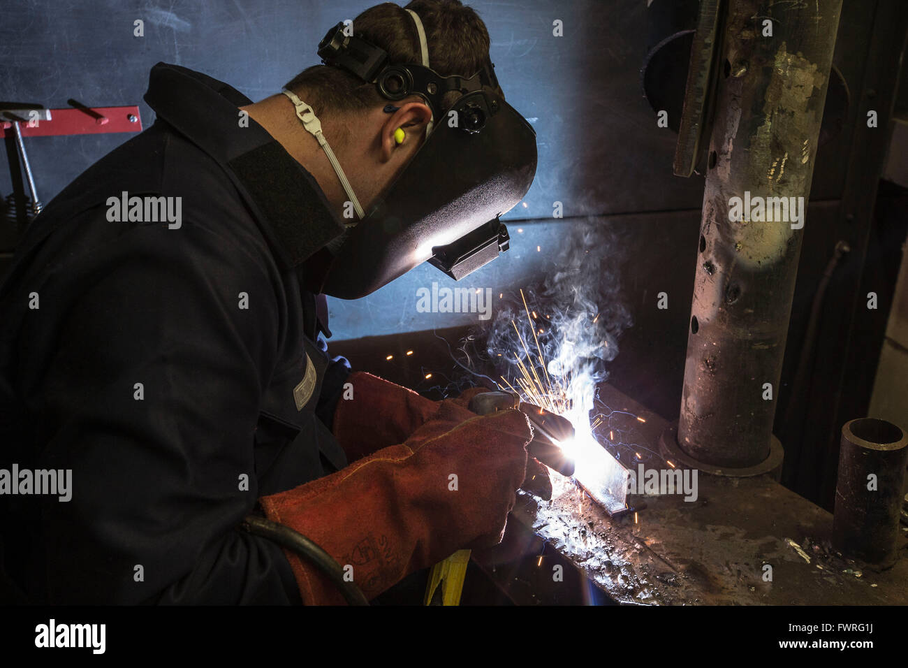 Worker welding using welding tools Stock Photo - Alamy