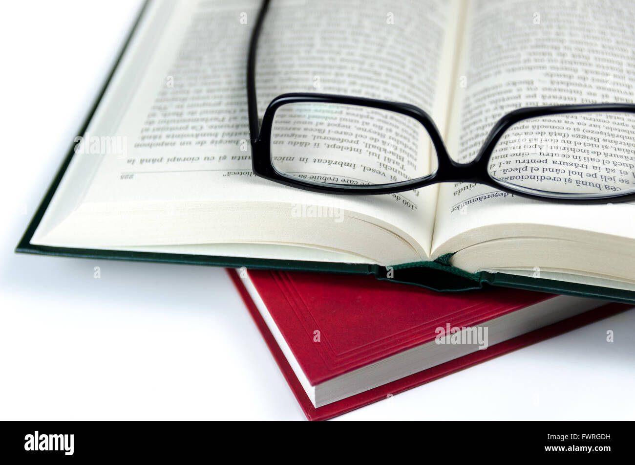 Open book and reading glasses Stock Photo - Alamy