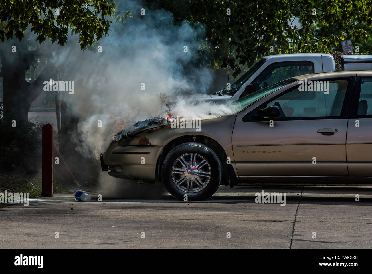 Car fire in parking lot of service station, fast food market Stock ...