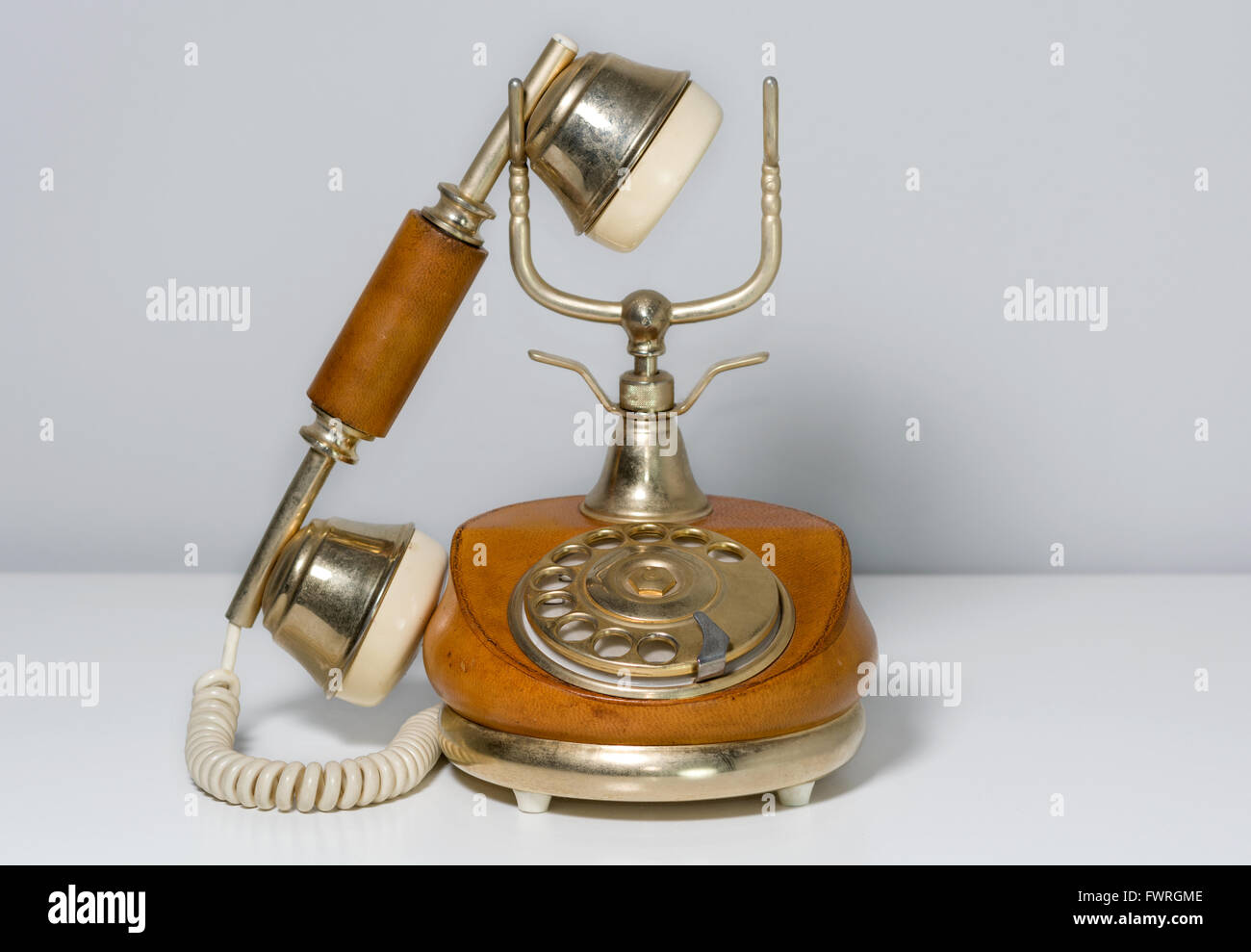 Elegant vintage telephone covered in brown leather Stock Photo - Alamy