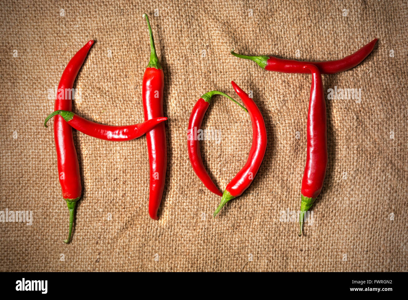 Word hot written from red pepper letters on rustic background Stock ...