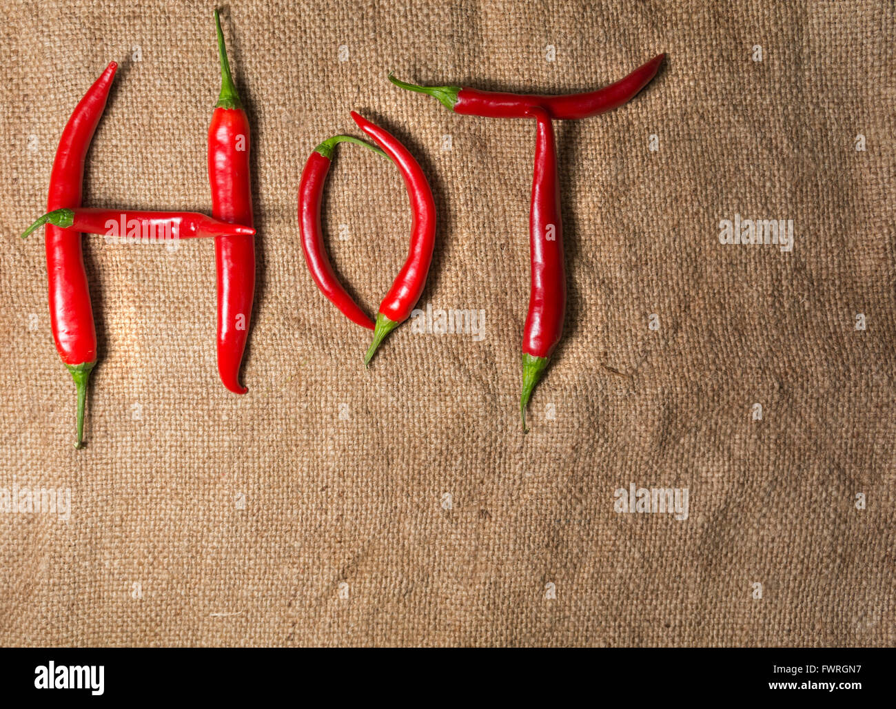 Word hot written from red pepper letters on rustic background Stock ...
