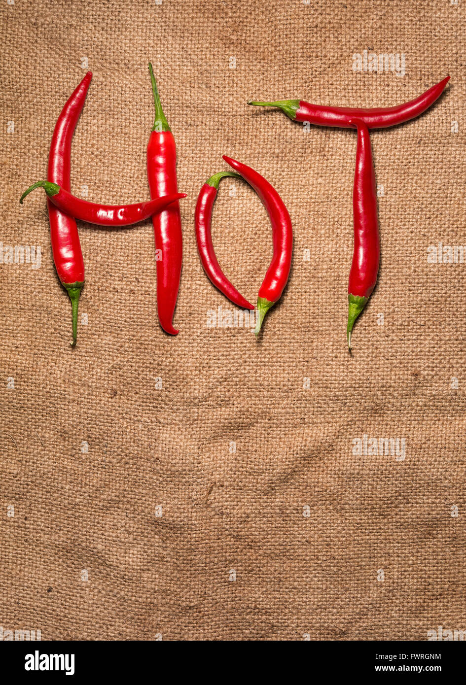 Word hot written from red pepper letters on rustic background Stock ...