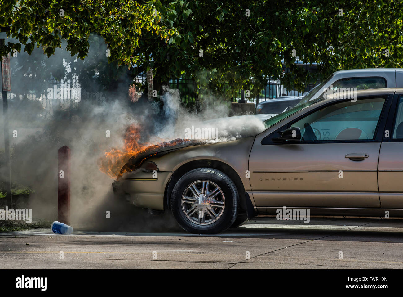 Car fire in parking lot of service station, fast food market Stock ...