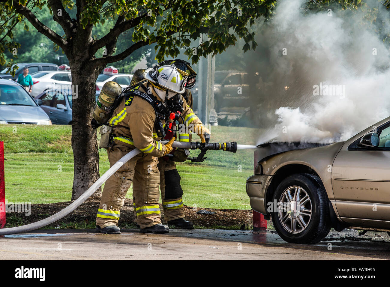 Car fire in parking lot of service station, fast food market Stock ...
