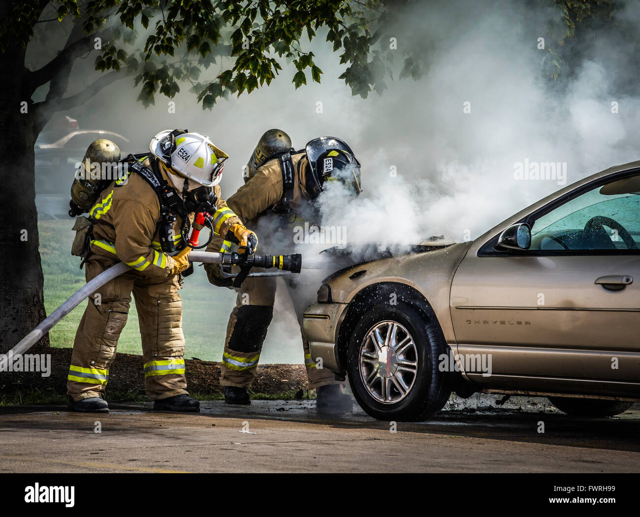 Car fire in parking lot of service station, fast food market Stock ...