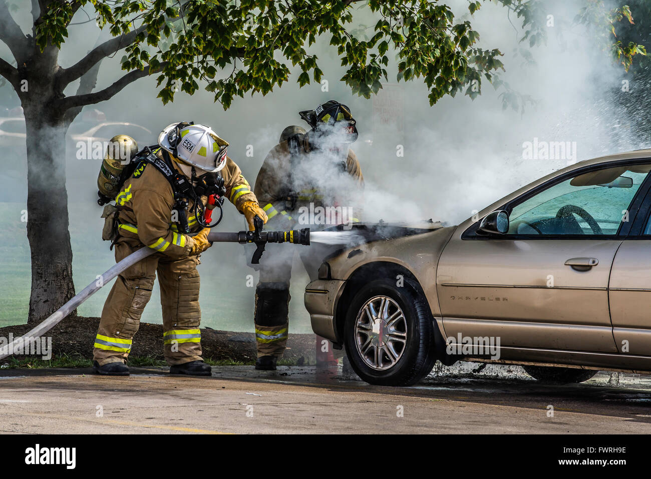 Car fire in parking lot of service station, fast food market Stock ...