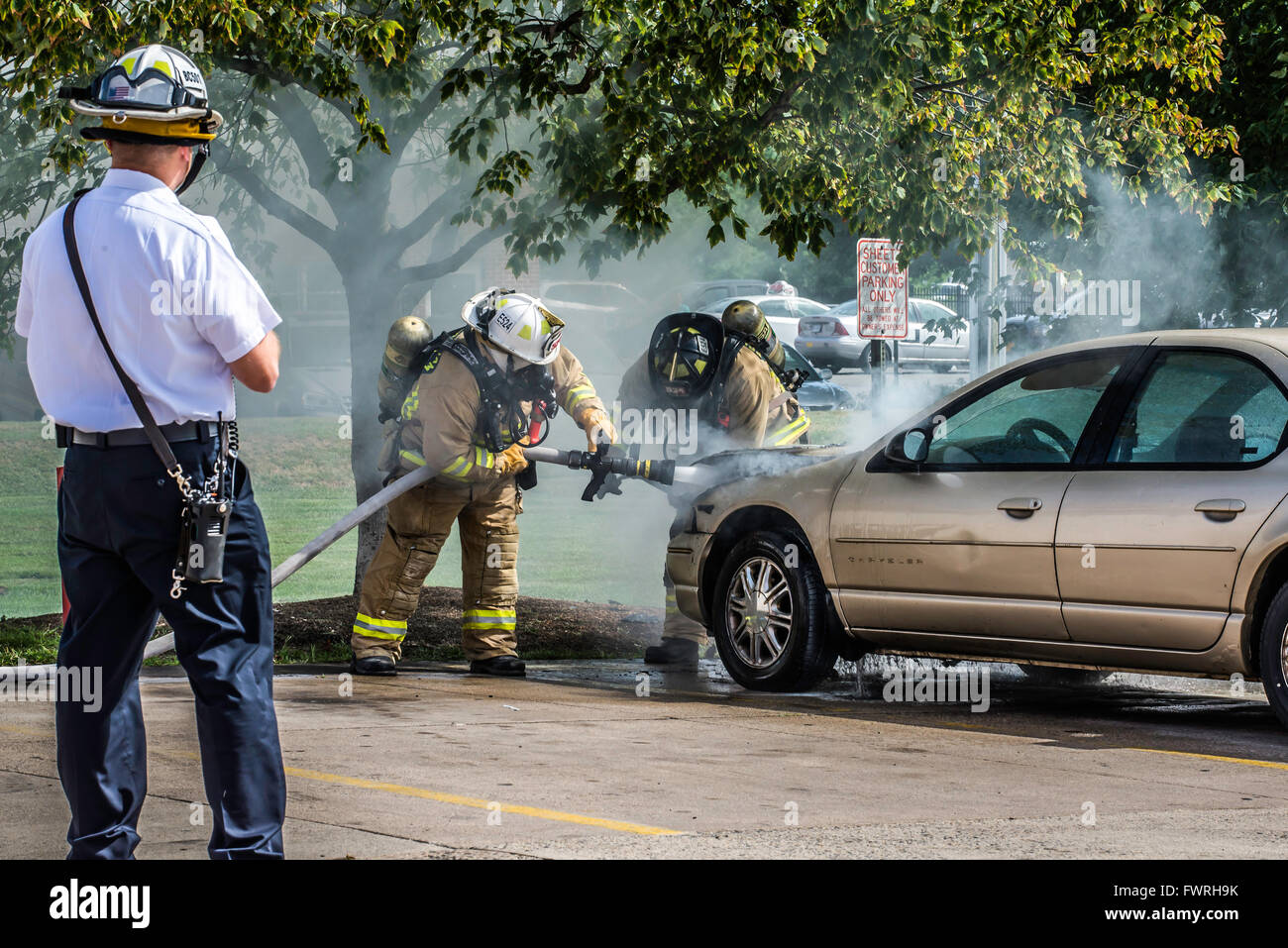 Car fire in parking lot of service station, fast food market Stock ...