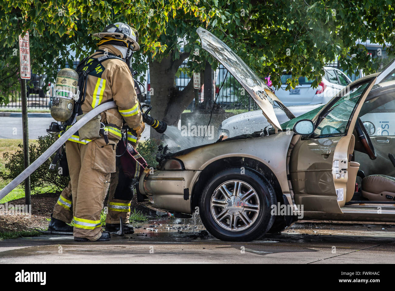 Car fire in parking lot of service station, fast food market Stock ...