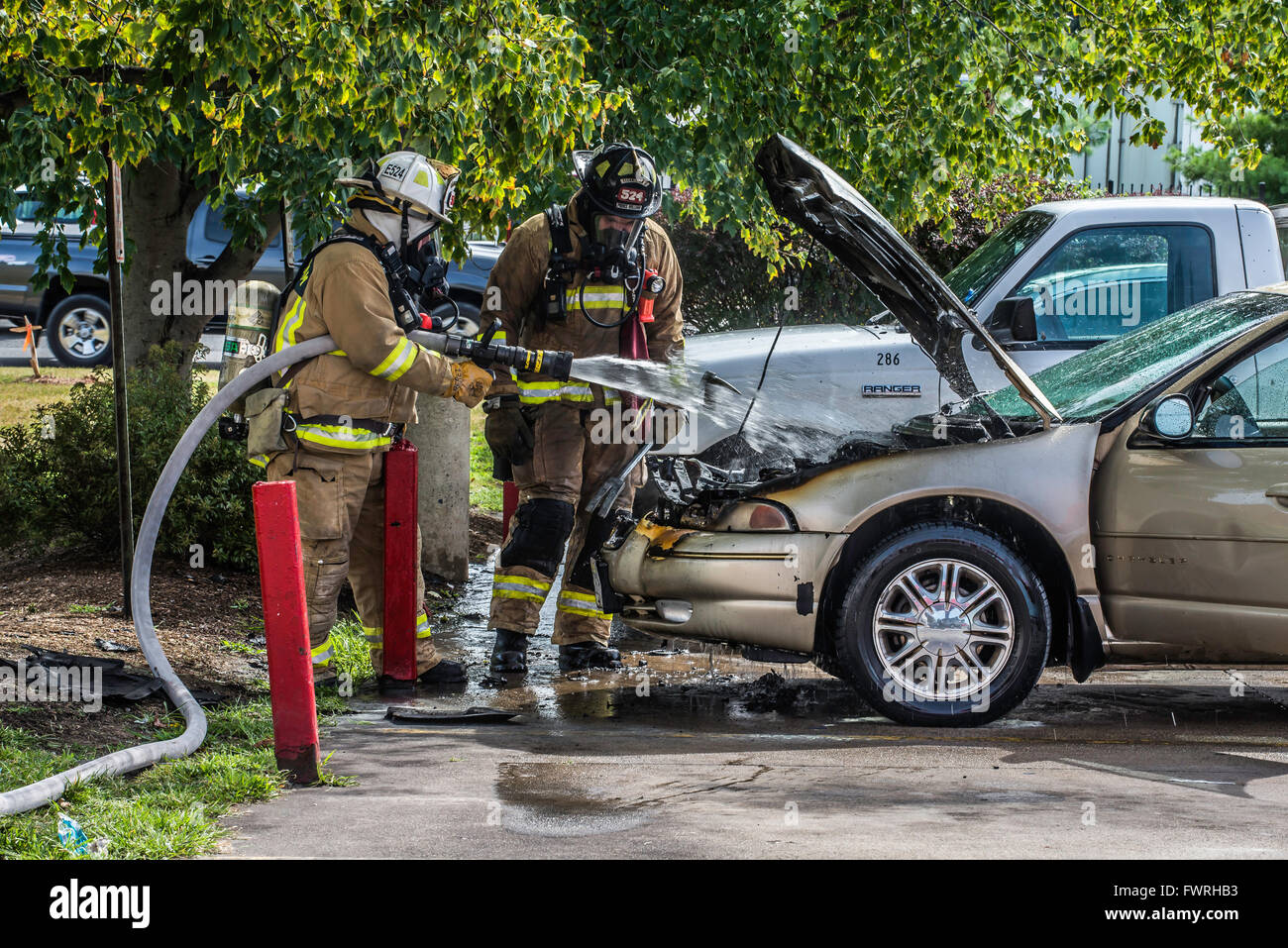 Car fire in parking lot of service station, fast food market Stock ...
