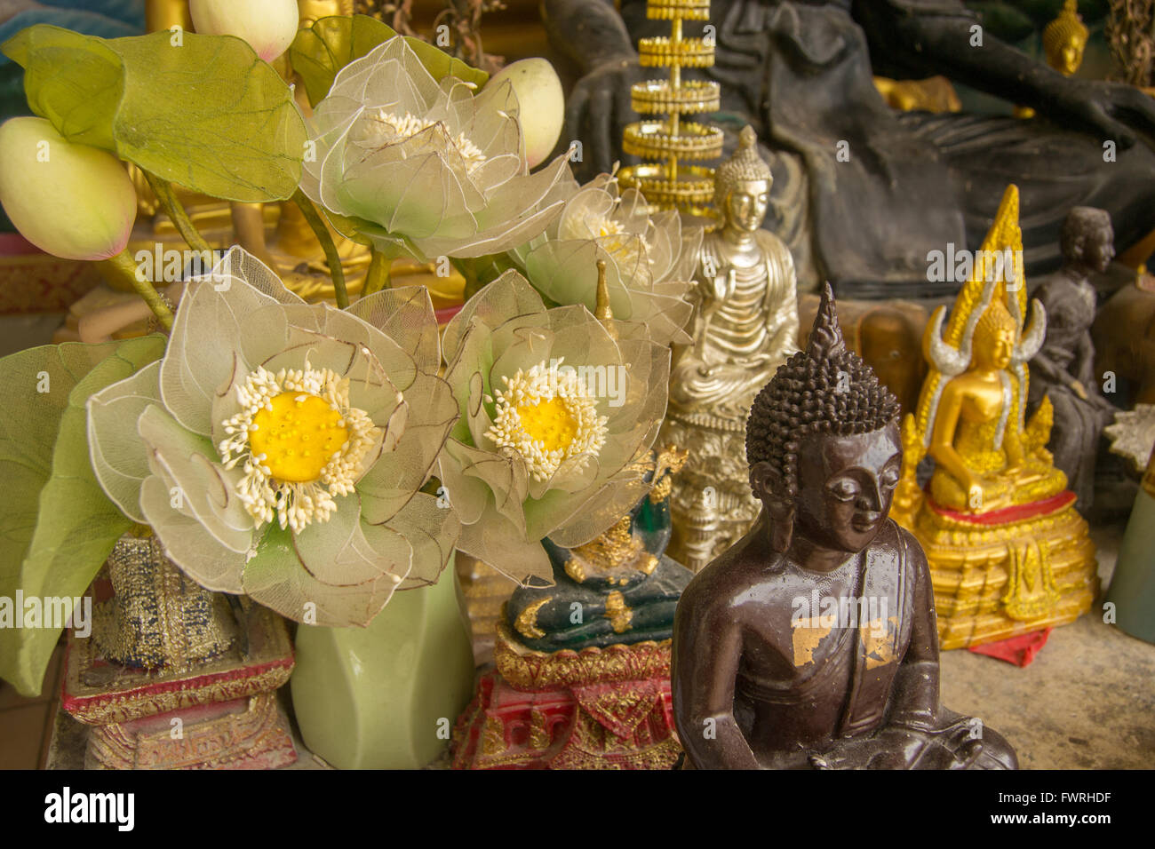 Offerings and ornaments in a Buddhist temple in Thailand Stock Photo ...