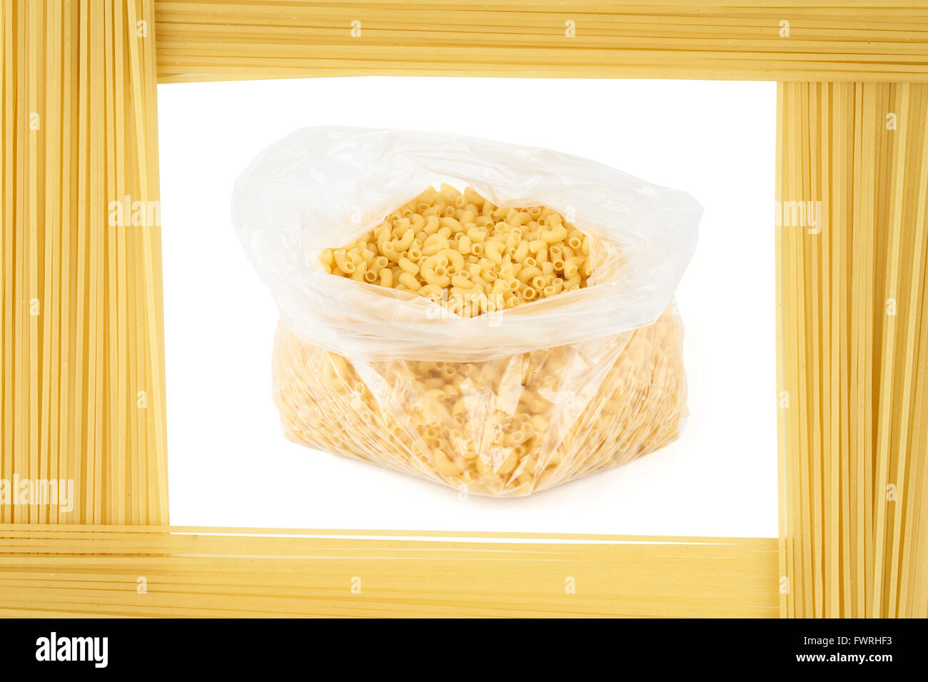 Pasta in open plastic pack framed by capellini (pasta). Food concept ...
