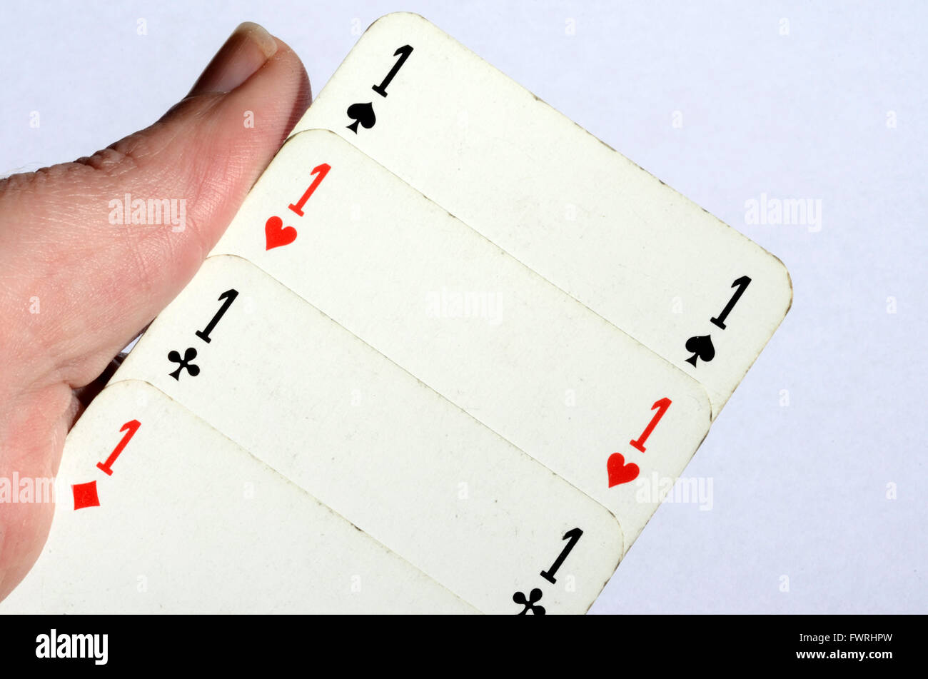 Hand holding playing cards with four aces hi-res stock photography and ...