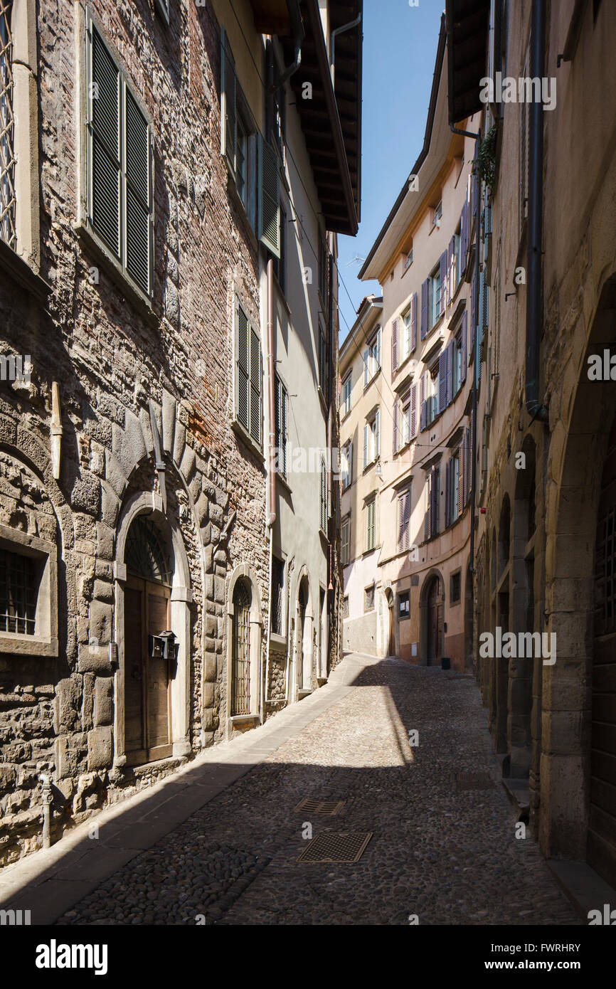 Beautiful curving street of tall buildings in Bergamo, Italy Stock ...