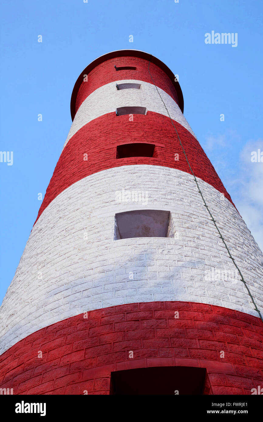 High lighthouse tower against the blue sky Stock Photo - Alamy