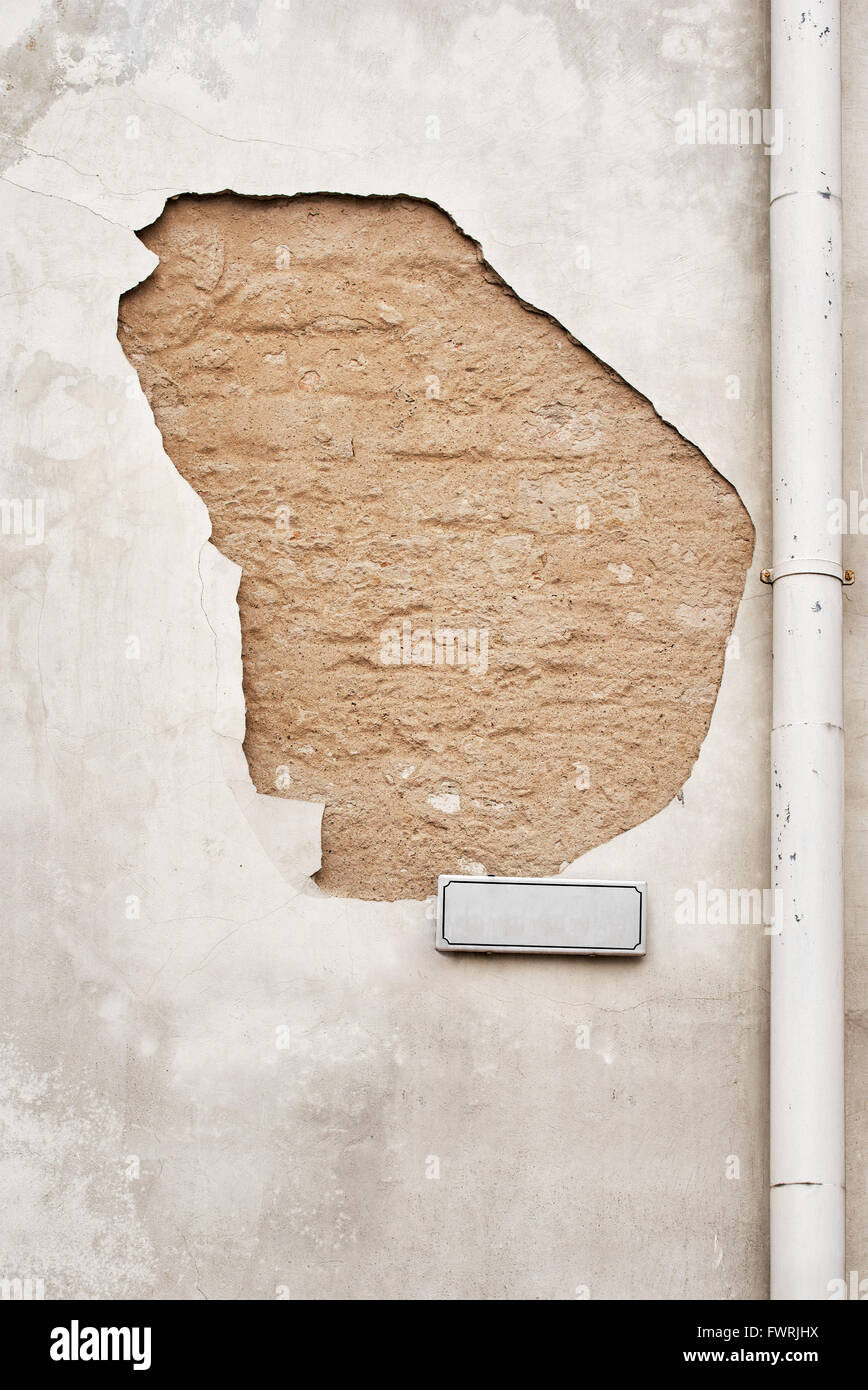 cracked wall with street sign Stock Photo - Alamy